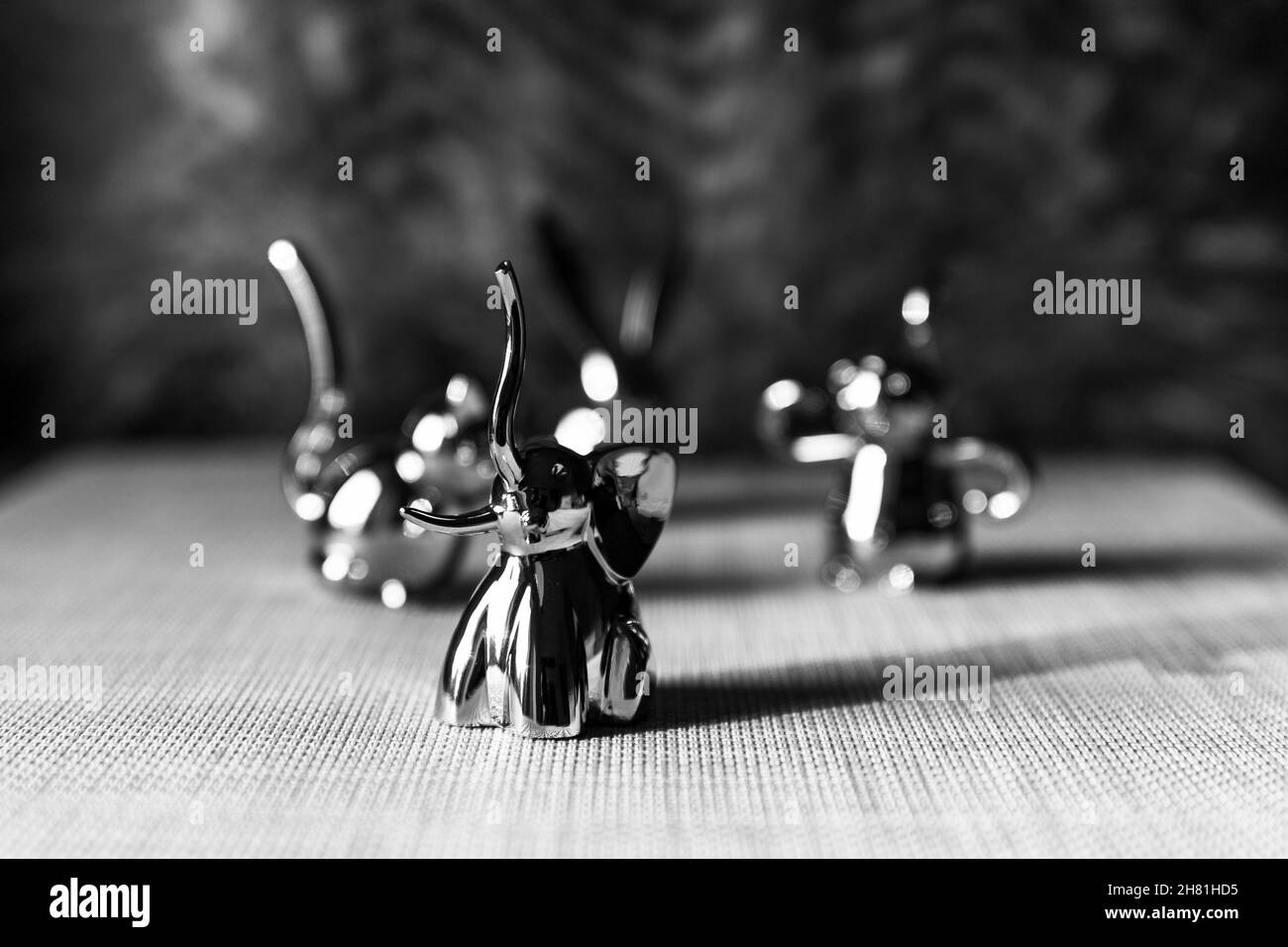 Elephant metal figurine, statue with other animals in background Stock ...
