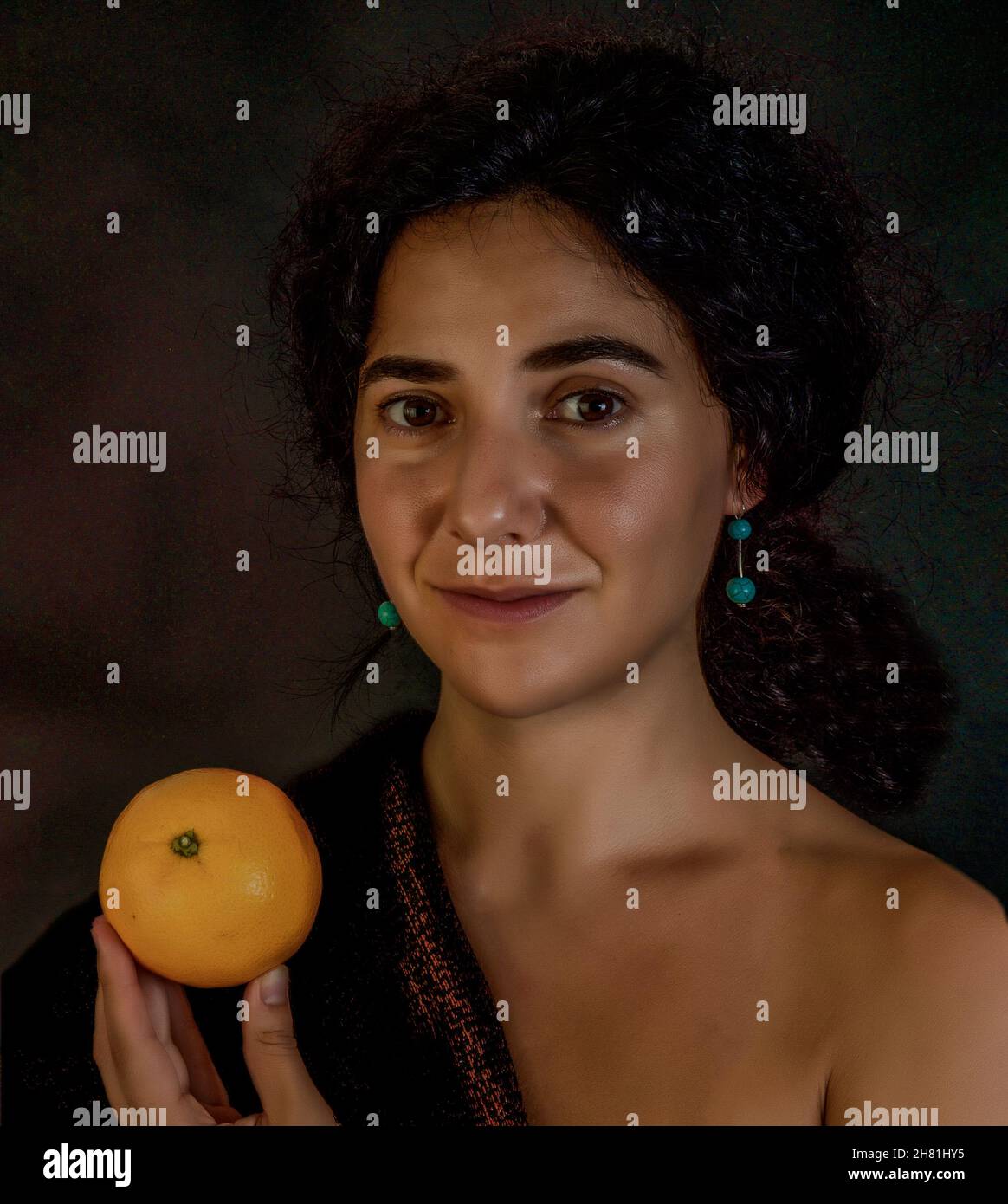 Portrait of a brunette Gypsy with an orange - Cordoba Stock Photo - Alamy