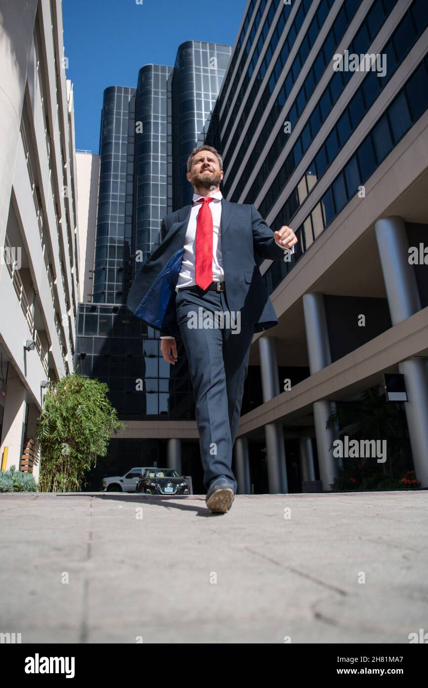 Business man walking on the street. Businessman walk near modern office ...