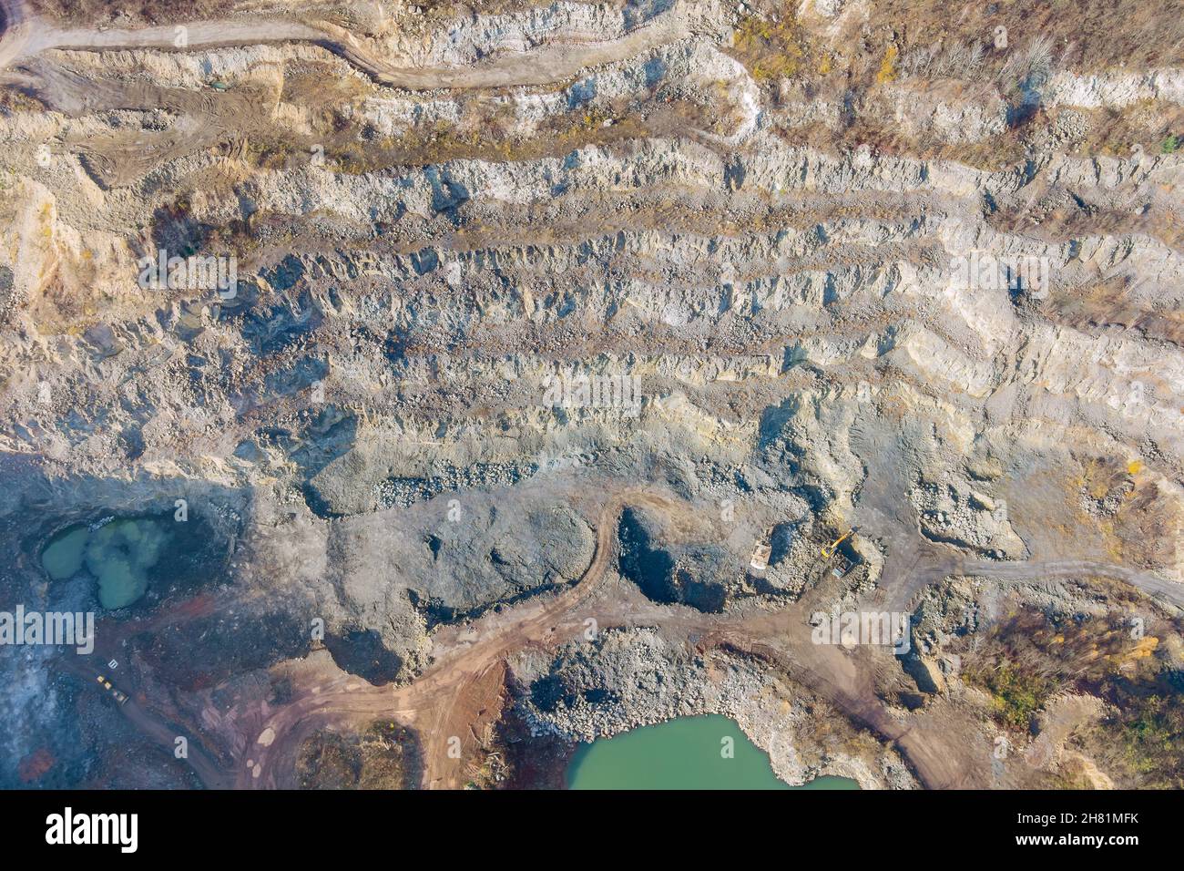 Mining industry quarry with working mining machines Stock Photo - Alamy