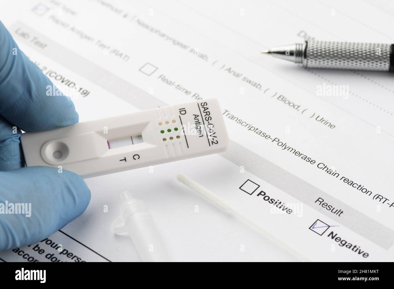 Close-up of rapid antigen test device showing a negative test result ...