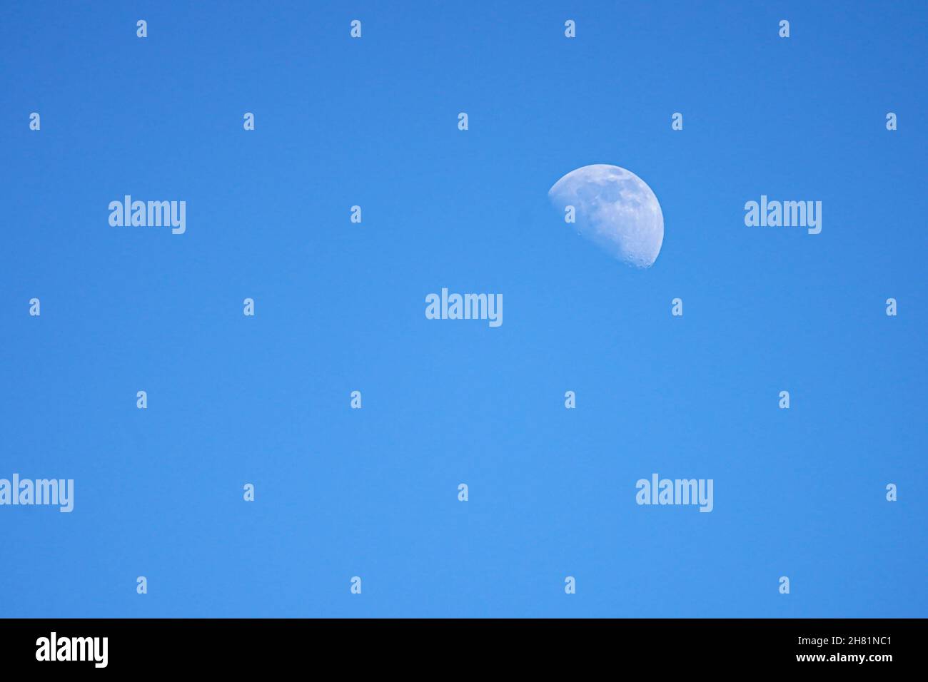 Blue sky with the moon on the corner Stock Photo - Alamy