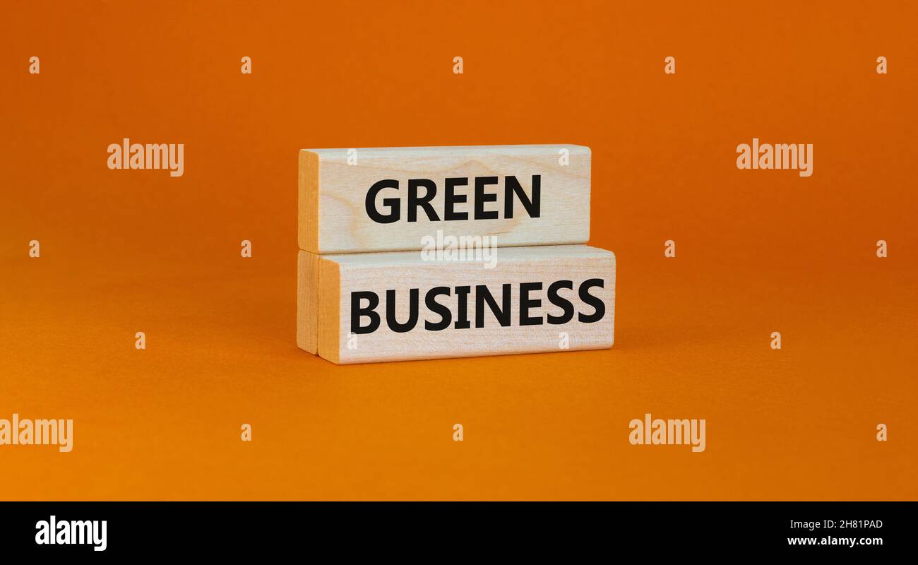 Time to green business symbol. Wooden blocks with words 'Green business ...