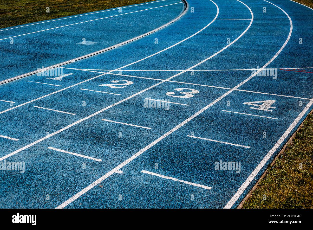 Lane one on the track field Stock Photo - Alamy