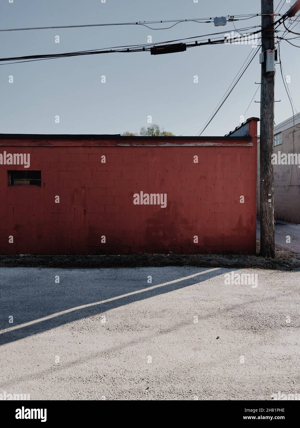 Vertical shot of a red fence with electric wires Stock Photo - Alamy