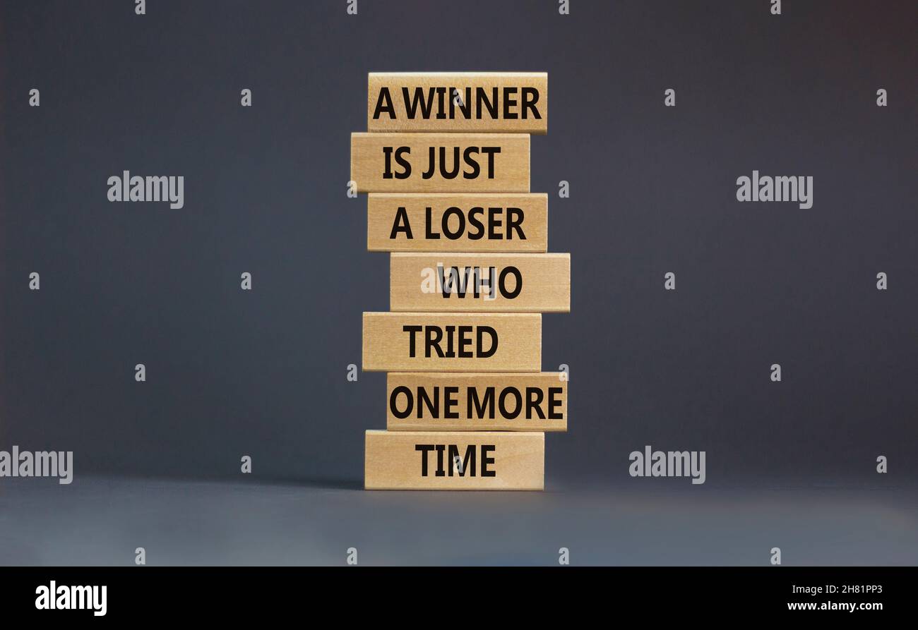 Winner or loser symbol. Wooden blocks with words A winner is just a ...