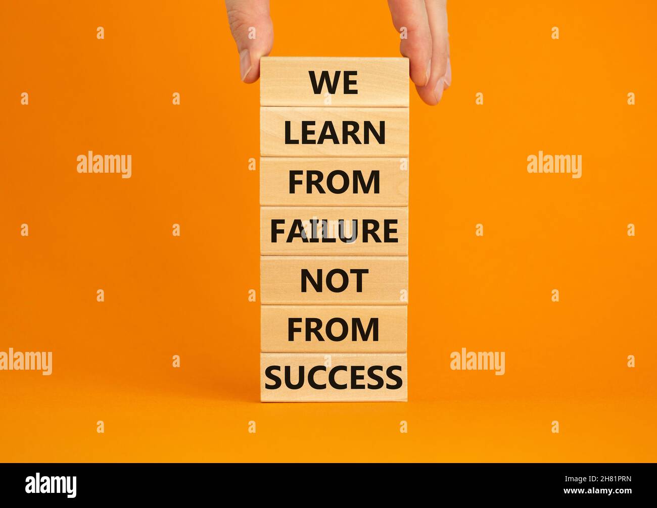 Failure or success symbol. Wooden blocks with words We learn from ...