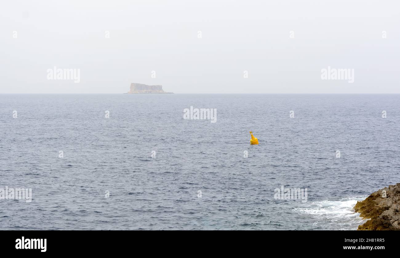 Yellow steel navigational floating buoy - Special Mark - in the blue ...