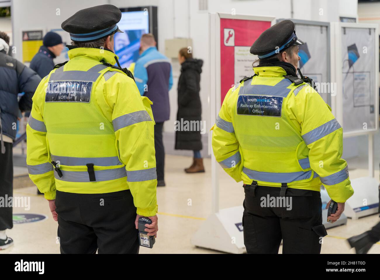 London, UK. 26th November 2021. Two uniformed railway enforcement ...