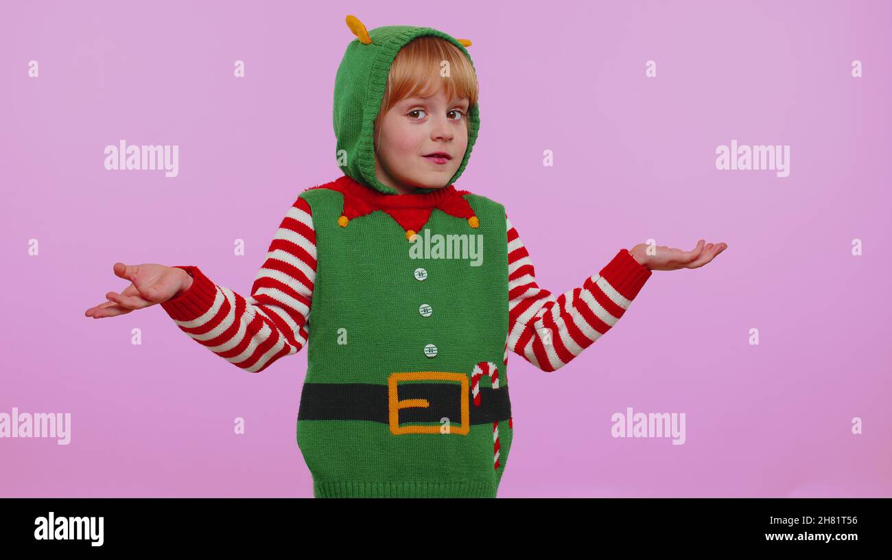 Confused girl in Christmas costume feeling embarrassed about ambiguous ...