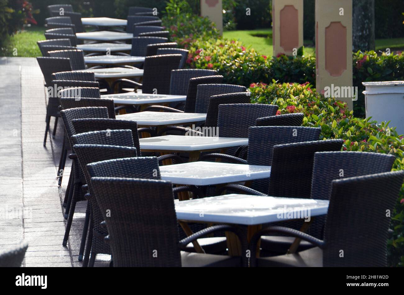 tables and chairs in the street Stock Photo - Alamy