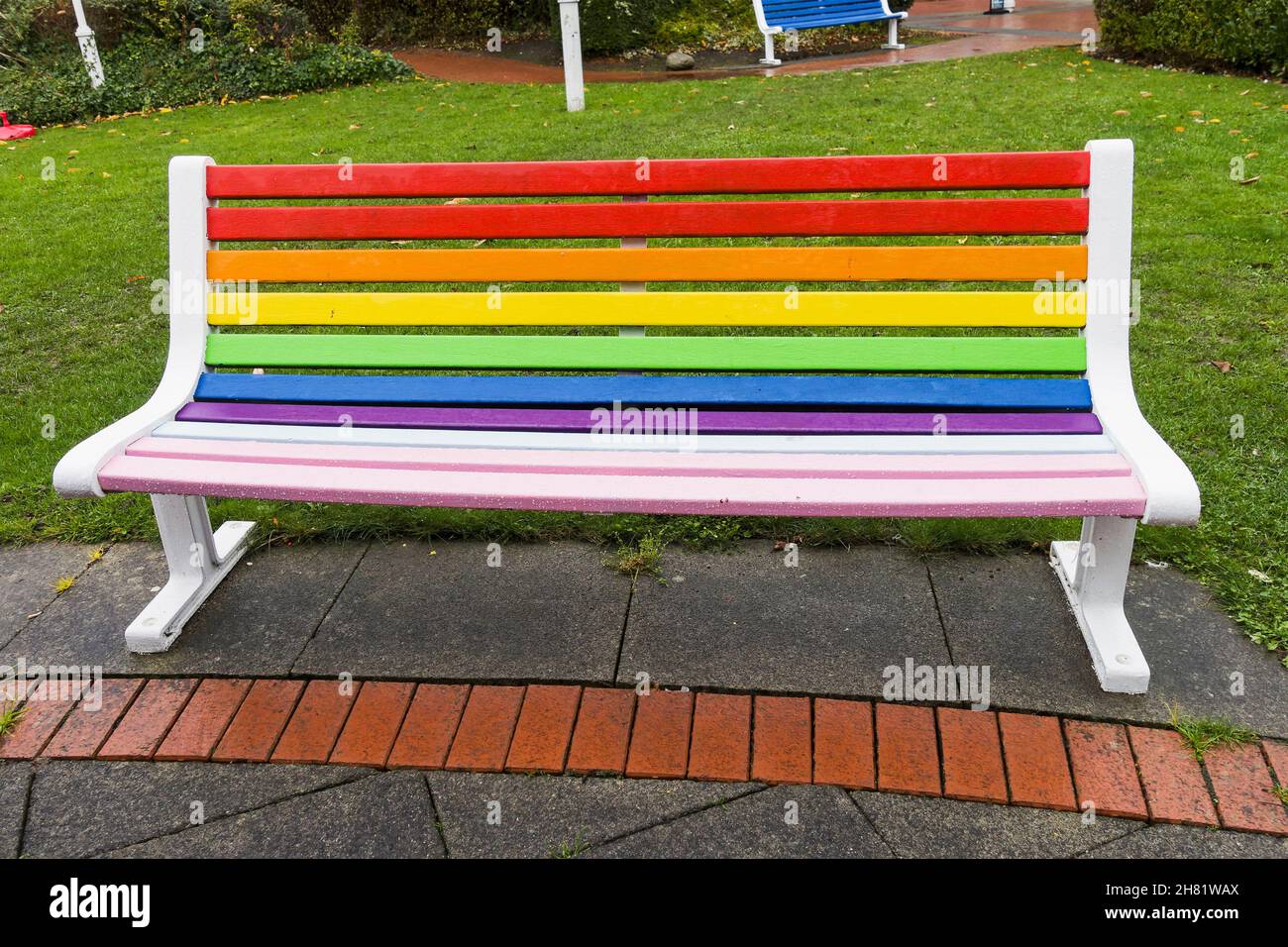 Rainbow painted bench seat in a UK retail park in 2021 Stock Photo - Alamy