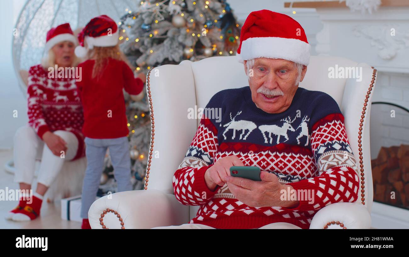 Mature christmas grandfather man mobile hi-res stock photography and ...