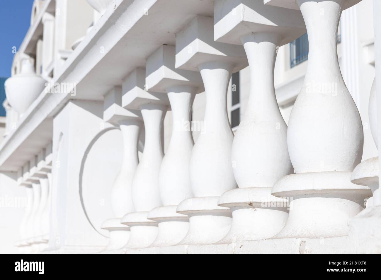 White terrace balusters made of painted concrete. Abstract classical ...