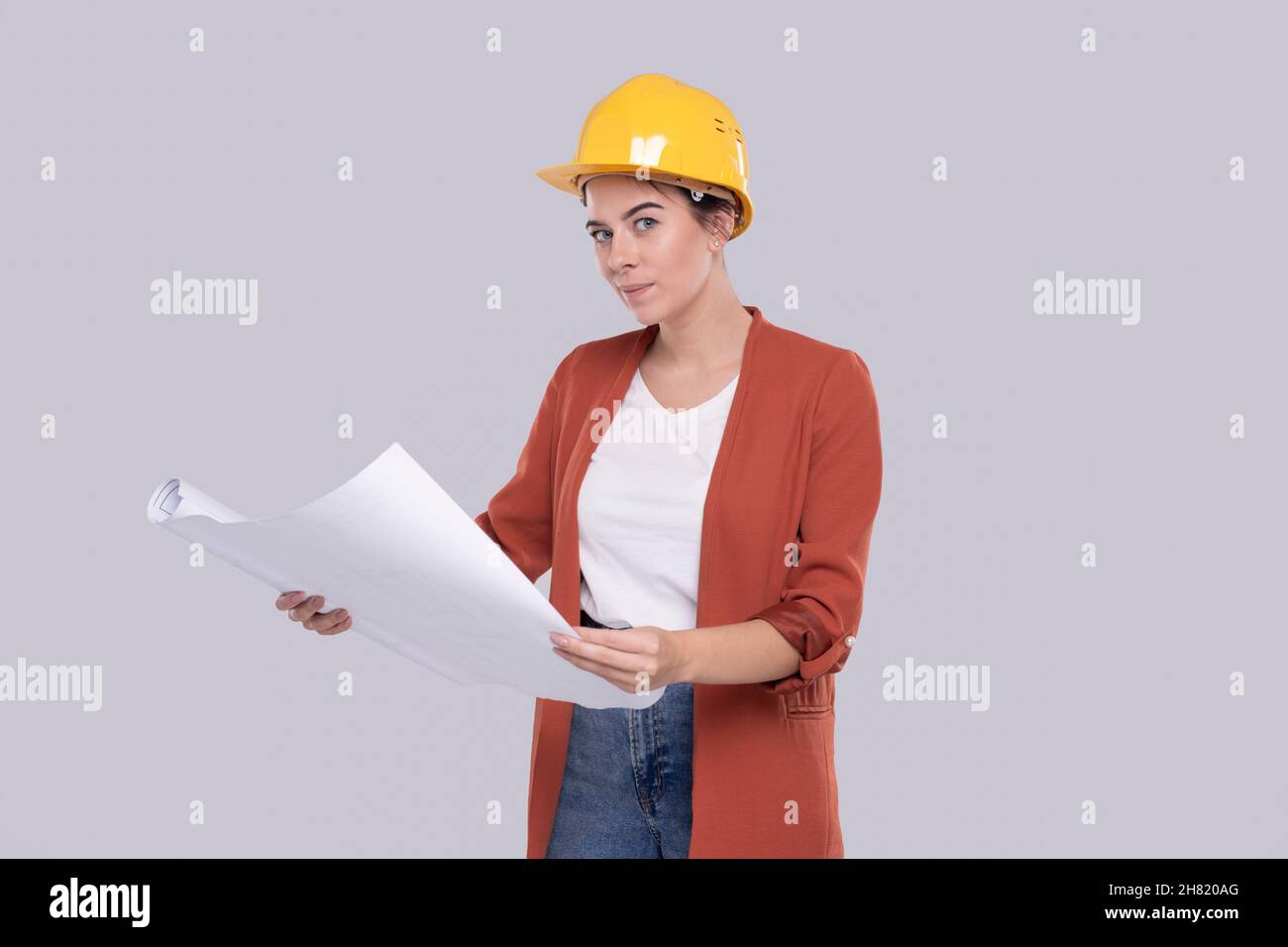 Girl Construction Worker Holding House Plan in Hands Watching at it ...