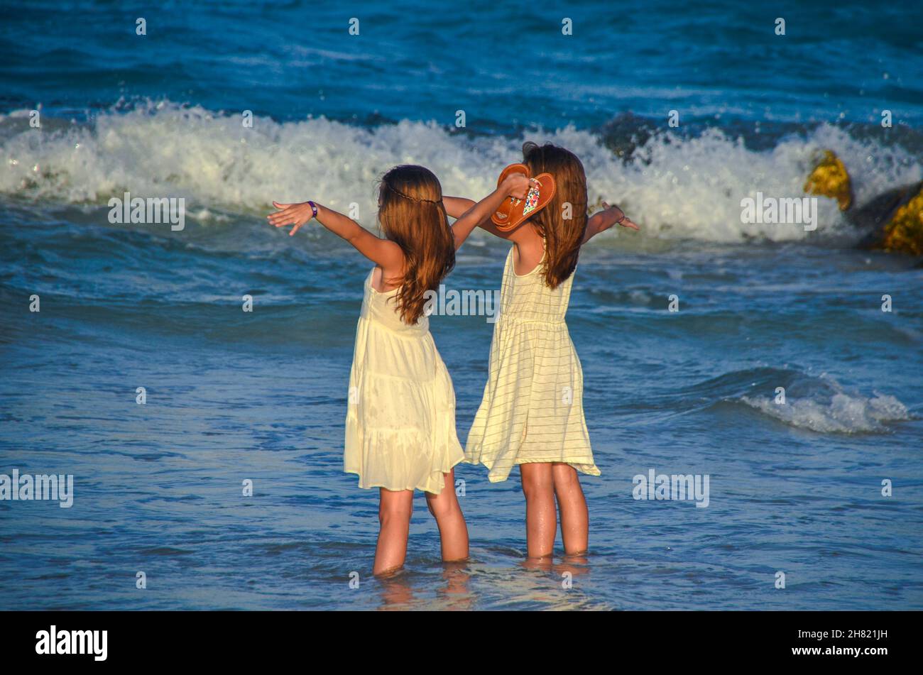 Two girls at the sea Stock Photo - Alamy