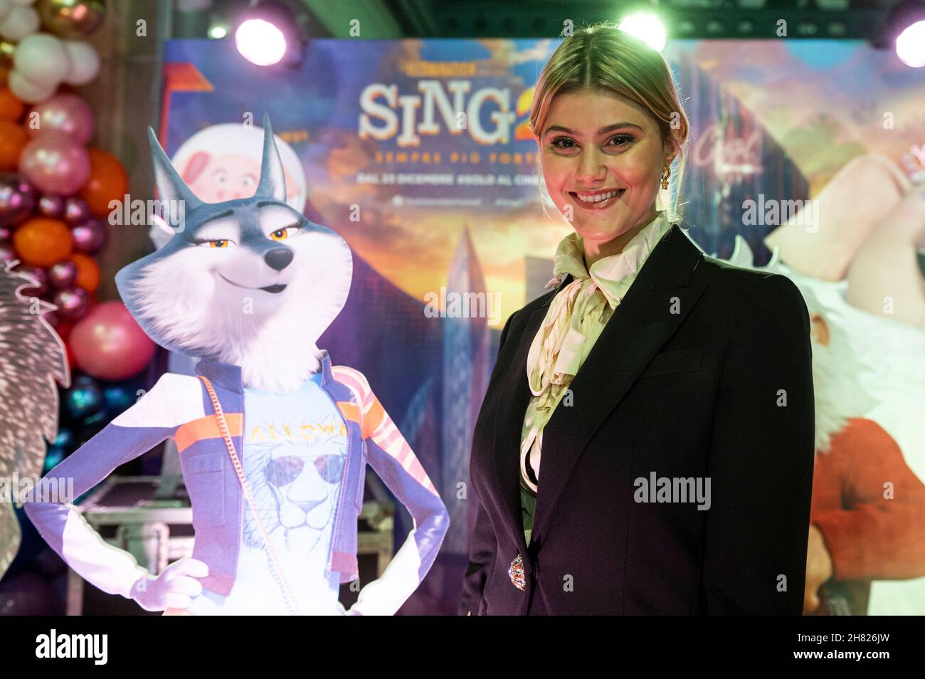 Turin, Italy. 26 November 2021. Jenny De Nucci poses next to a placard ...