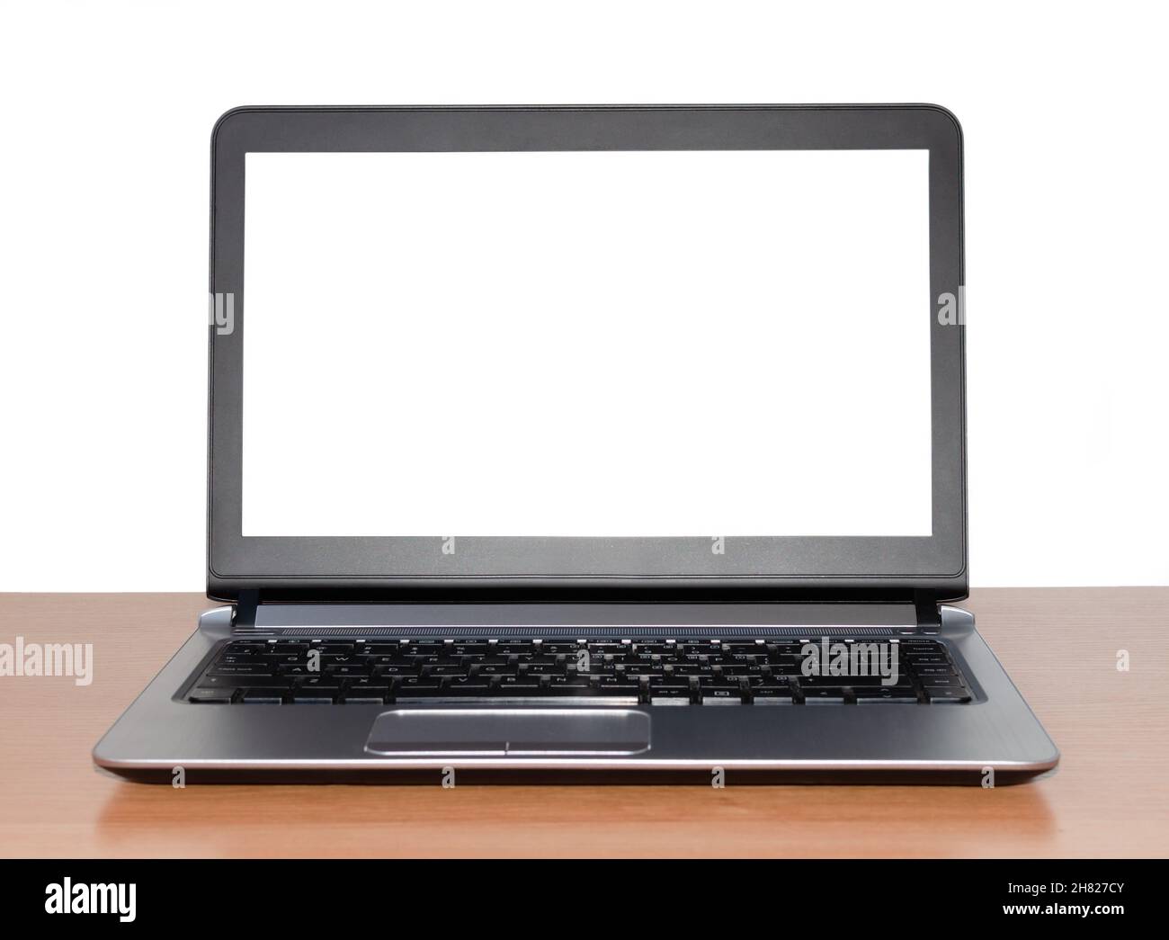 laptop computer screen on a light wooden table, with empty space for ...