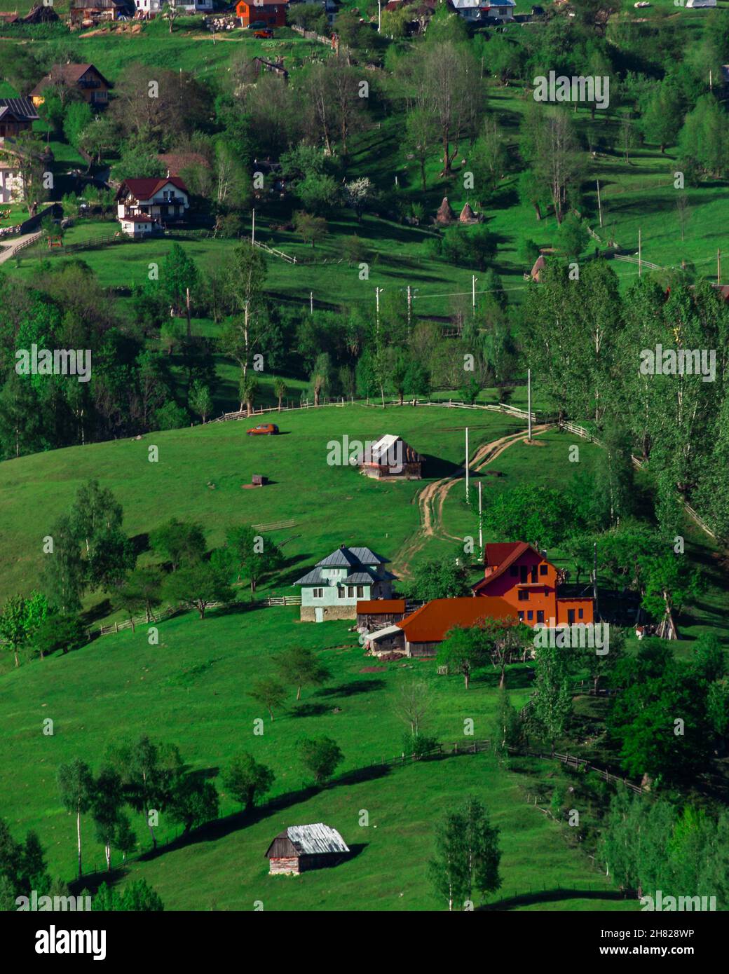 Vertical shot of beautiful houses among the beautiful nature Stock ...