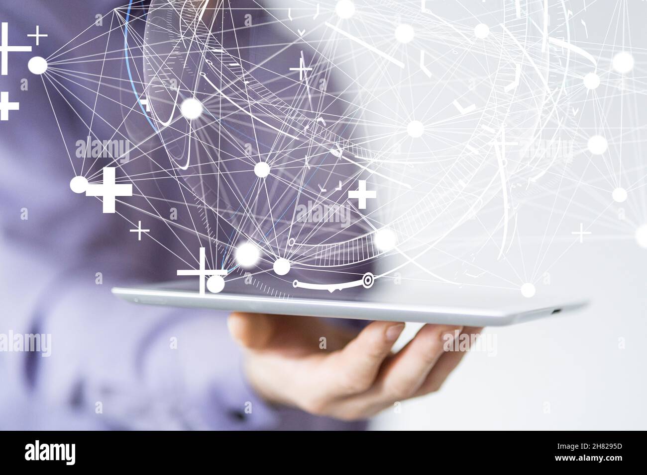 A sphere made of interconnected dots on a businessman's tablet - global ...