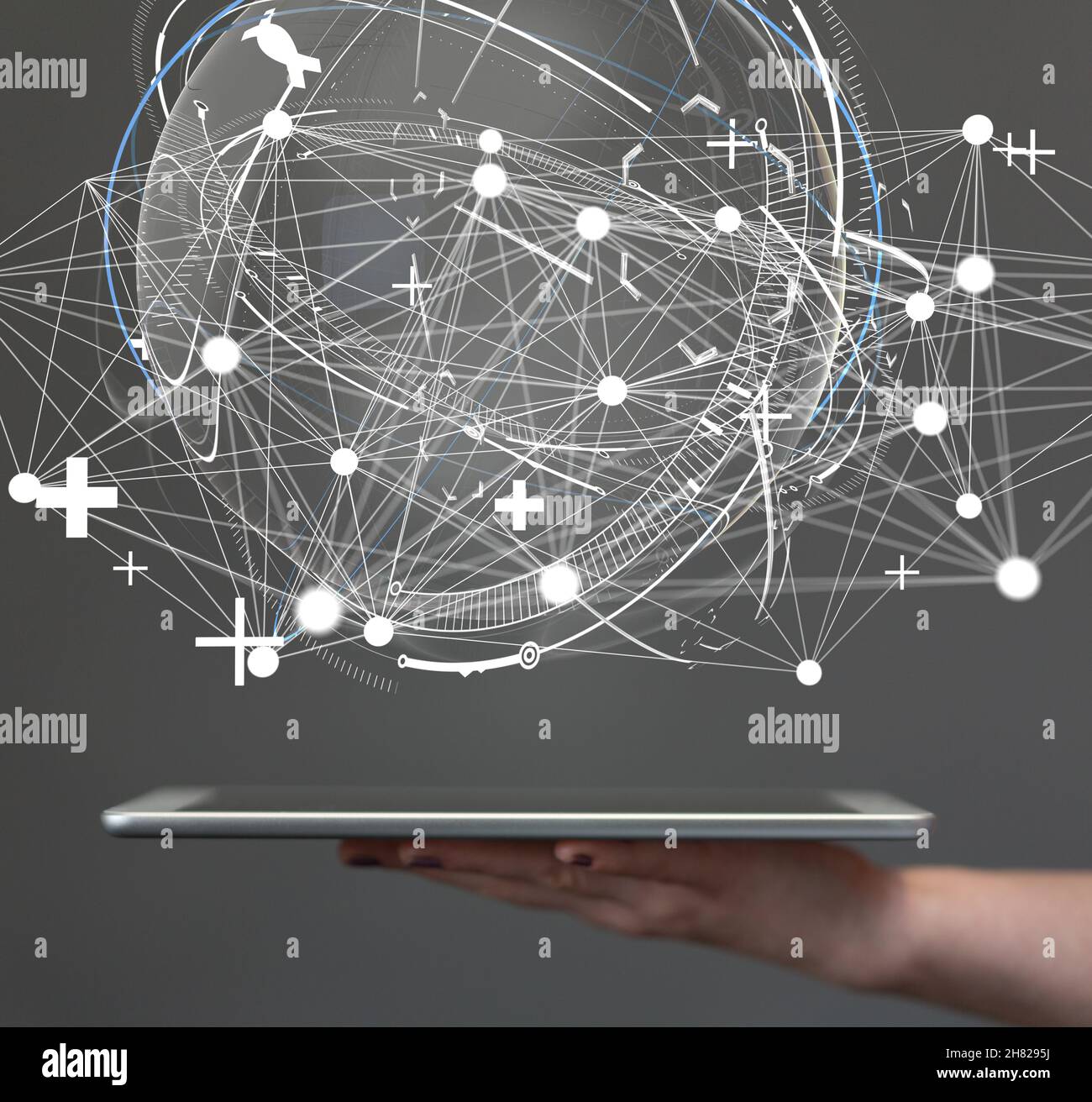 A sphere made of interconnected dots on a businessman's tablet - global ...