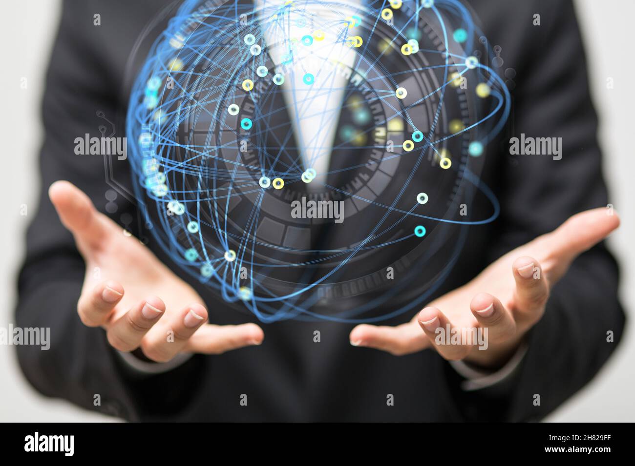 A sphere made of interconnected dots on a businessman's palms - global ...