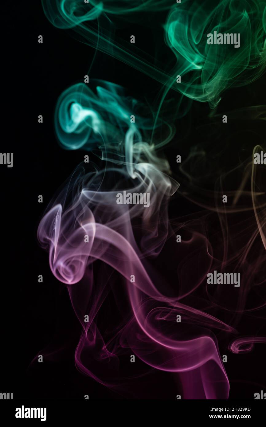 abstract colored smoke on black background Stock Photo - Alamy