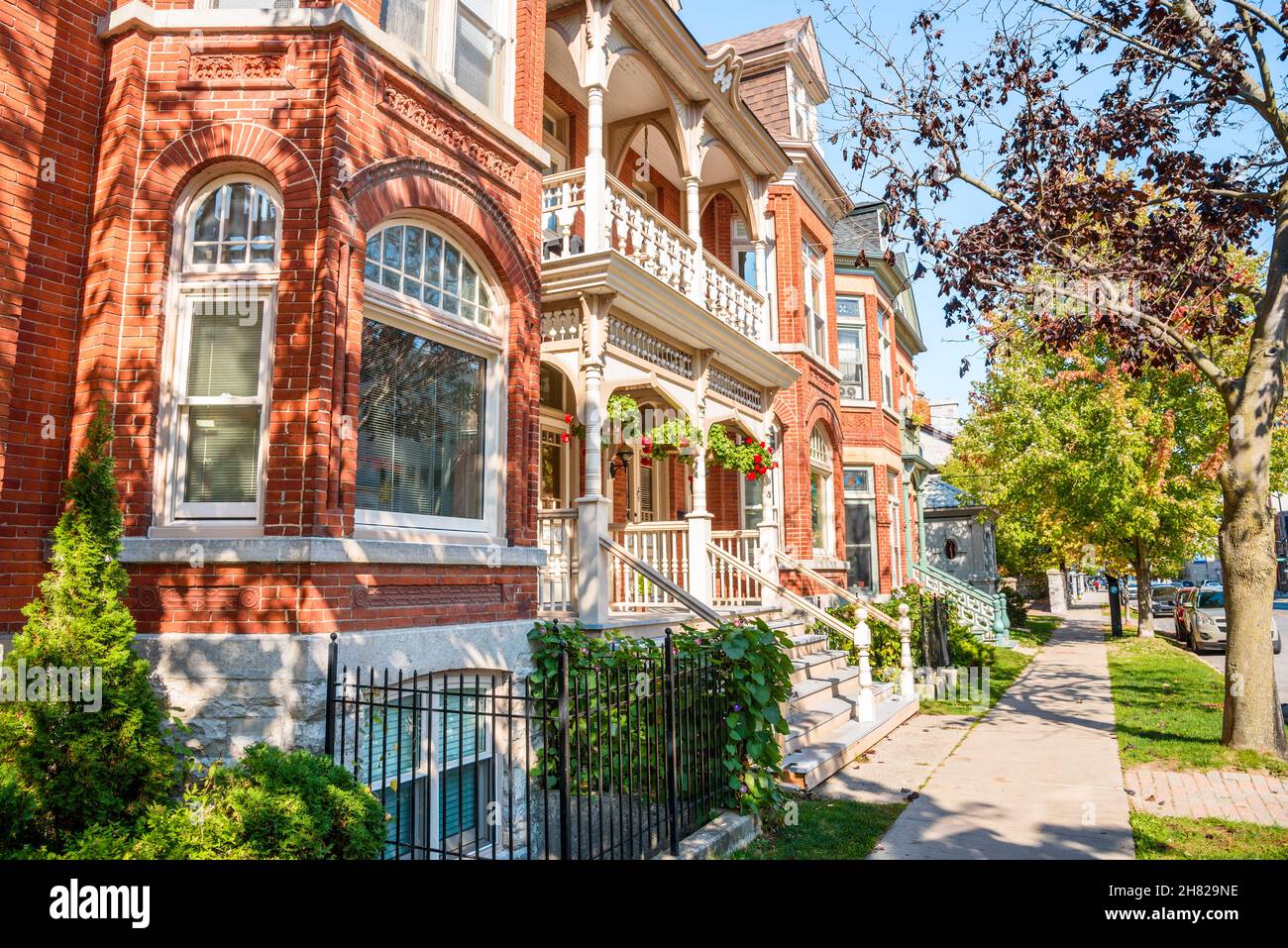 Traditional red brick residential buildings with stairs leading up to ...