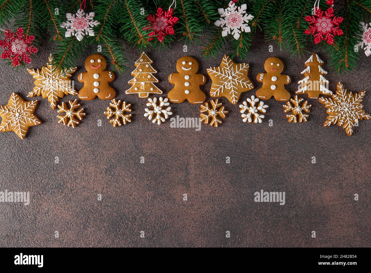 Border from homemade gingerbread cookies in shaped of christmas tree ...