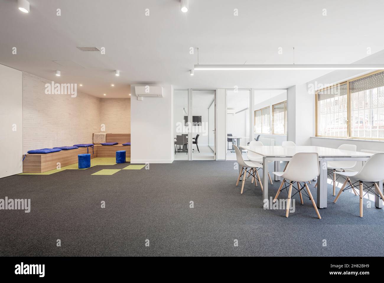 Coworking work area in an office with desks and anti-stress seats Stock ...