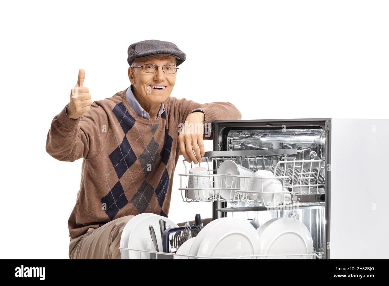 Elderly man with a dishwasher machine showing thumbs up isolated on ...