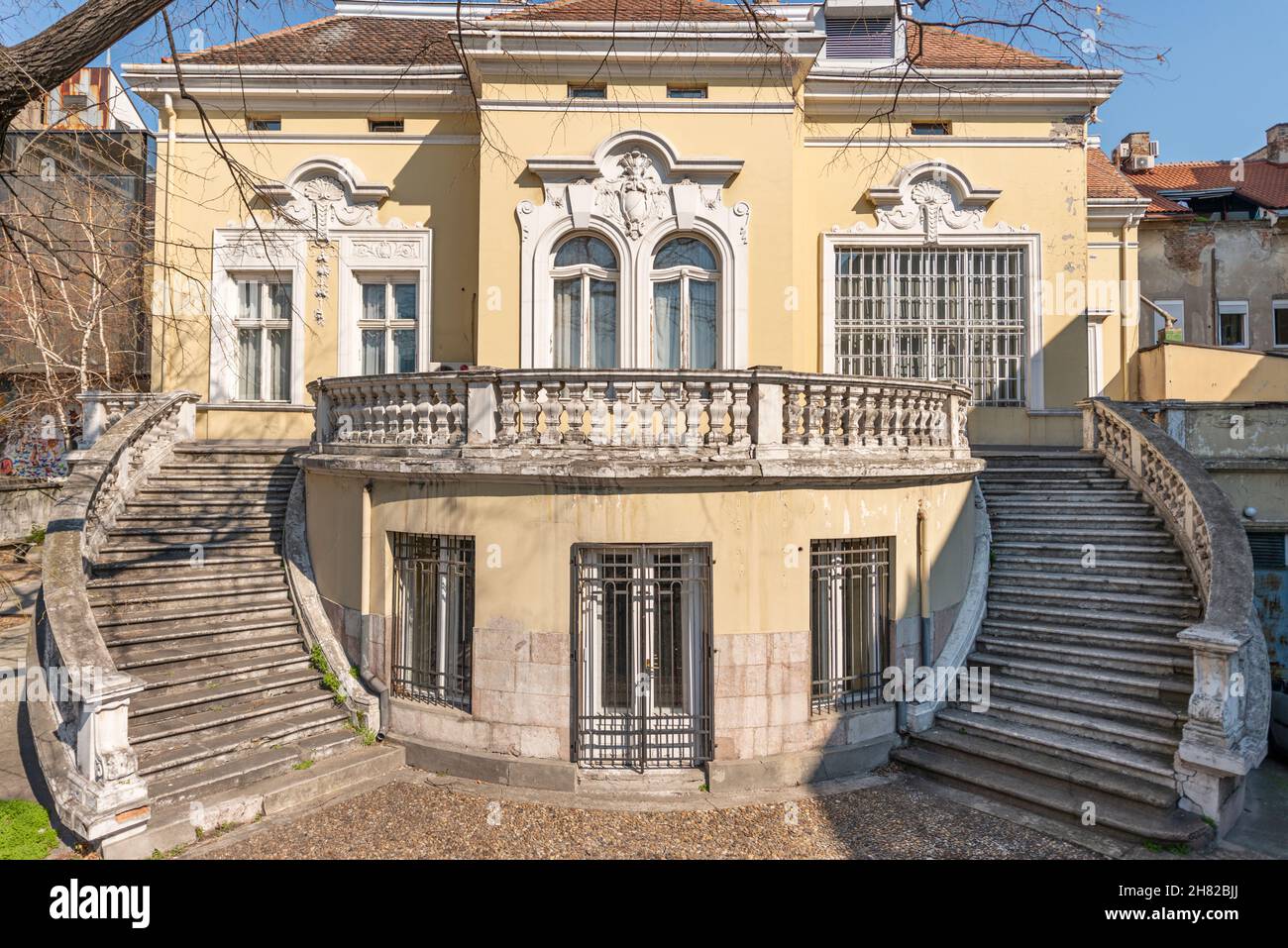 Beautiful vintage building with symmetrical stairways in the city of ...