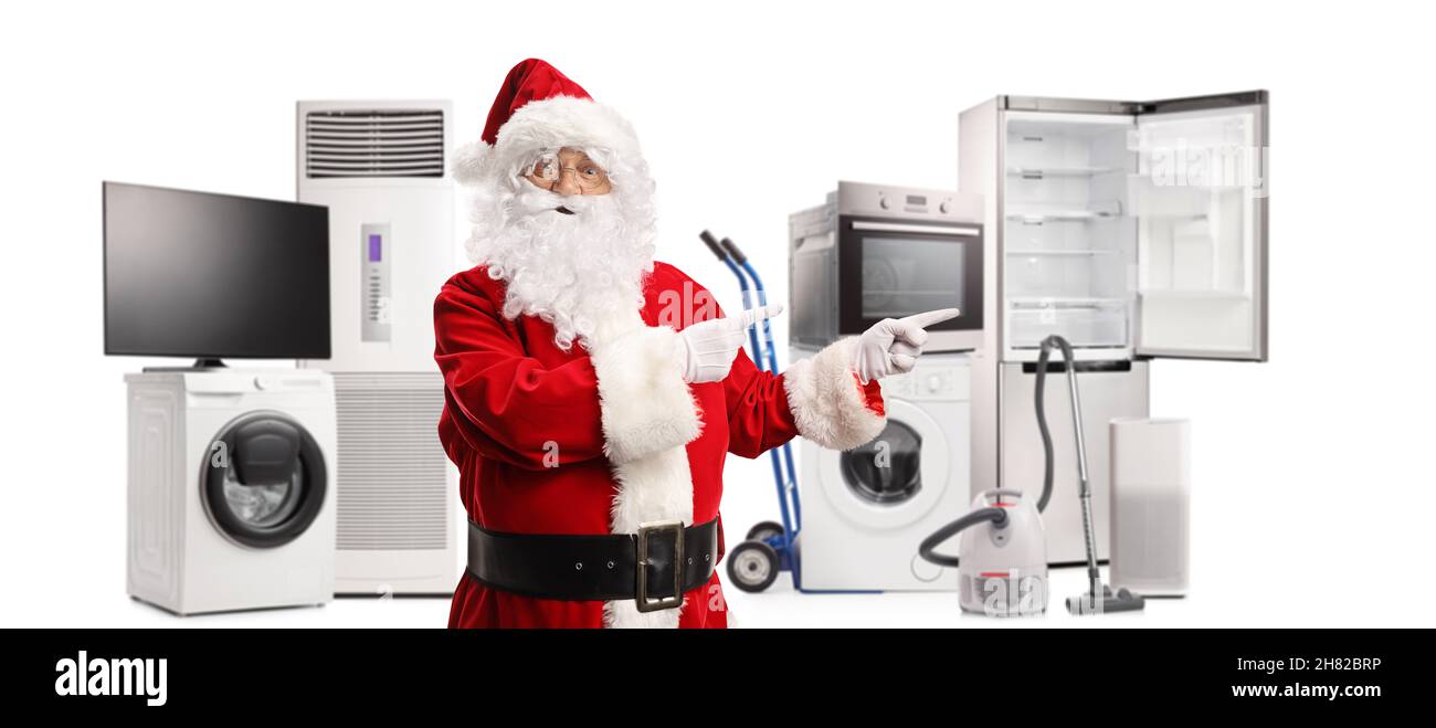 Santa claus showing electrical home appliances isolated on white ...