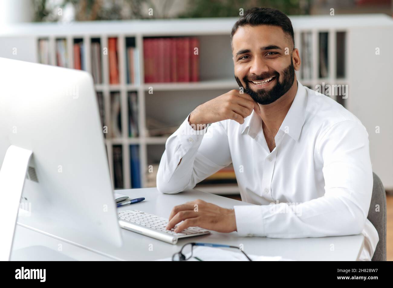 Portrait serious boss sitting table hi-res stock photography and images ...
