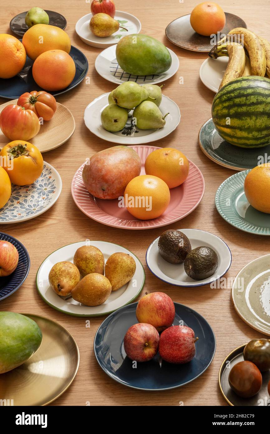 Lots of different dishes with many kinds of delicious fruits, red ...