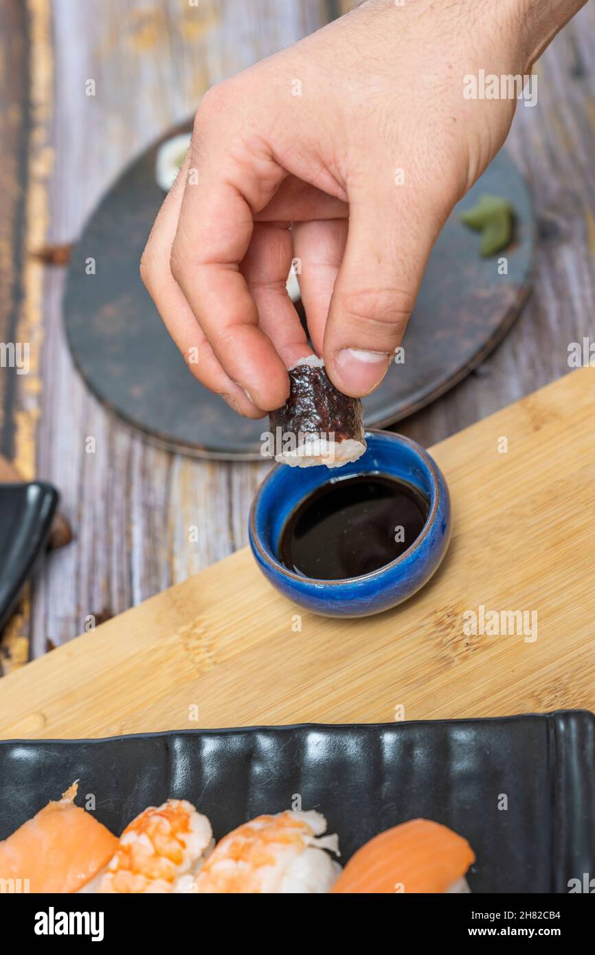 Food dip hand hi-res stock photography and images - Alamy