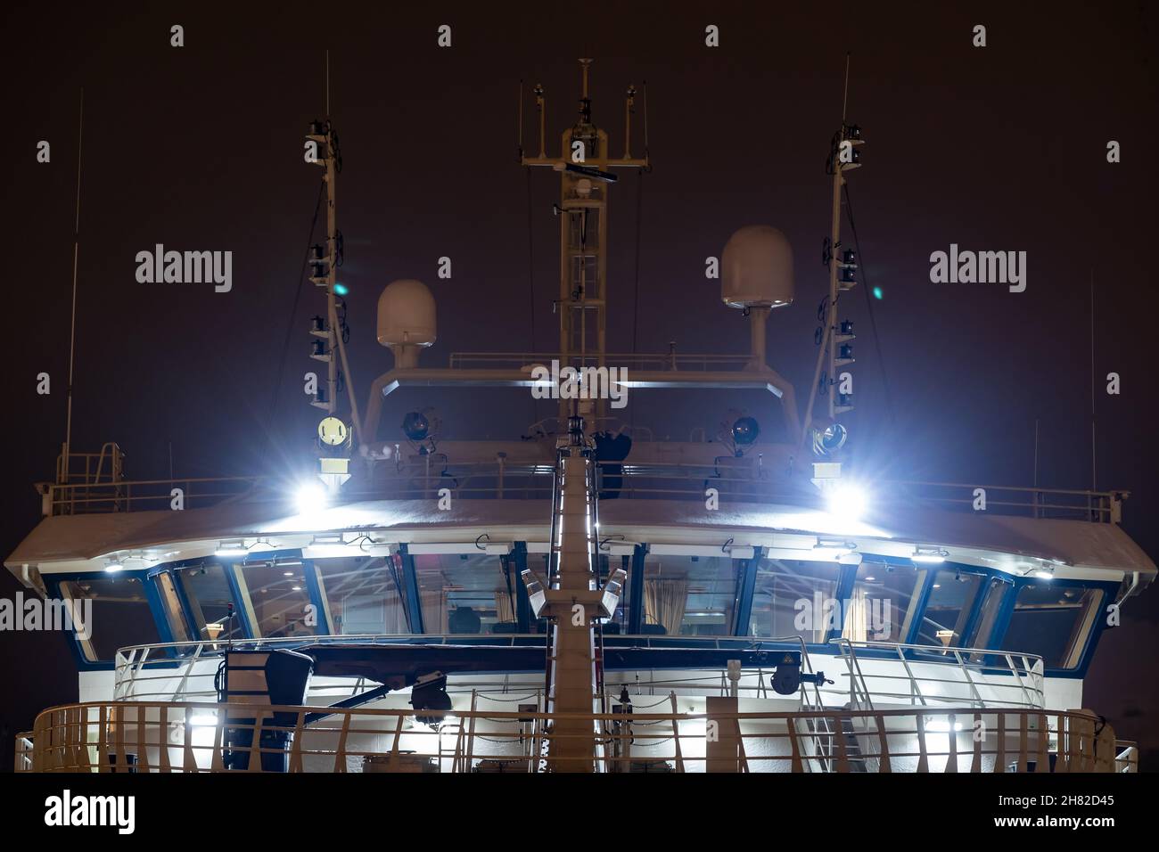 Night close-up of the cockpit of a huge ship with night illumination ...