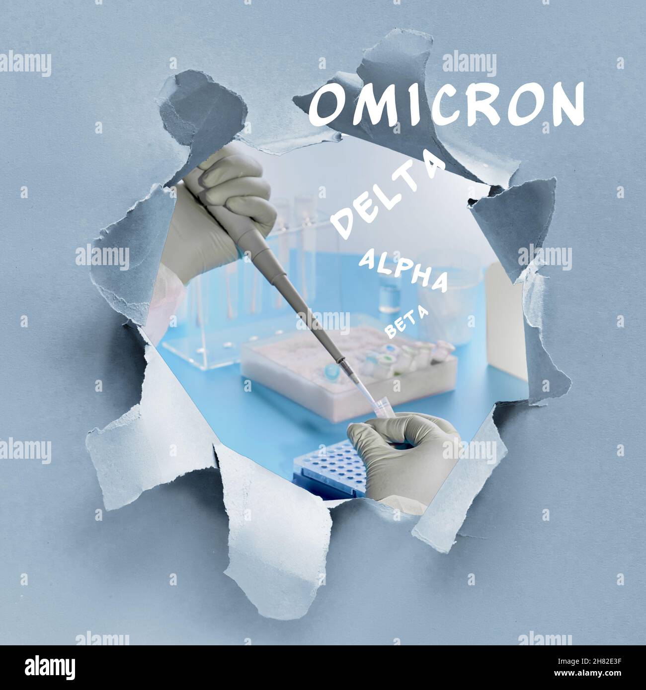 Omicron, new Coronavirus variant of concern. Paper hole with image of ...
