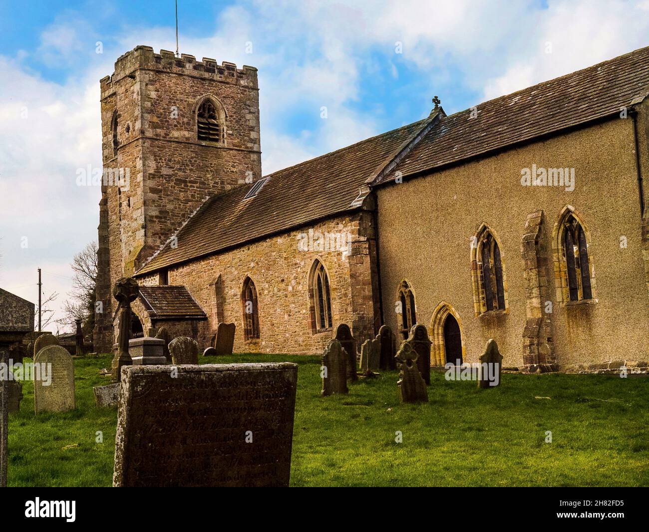 All Hallows Church and churchyard in the village of Great Mitton ...