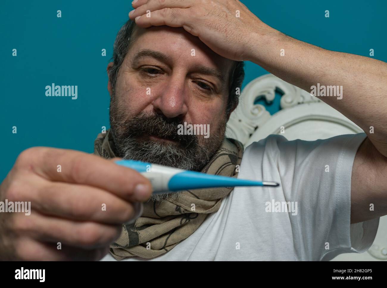Senior adult male infection thermometer hi-res stock photography and ...