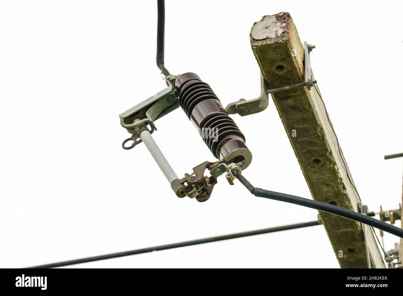 Drop fuse on high-voltage electrical pole supply Stock Photo - Alamy