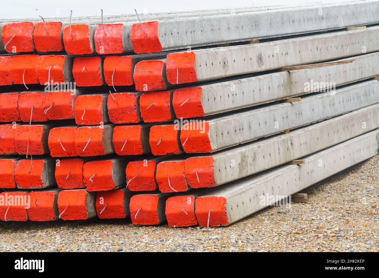 Stack of electrical concrete poles Stock Photo - Alamy