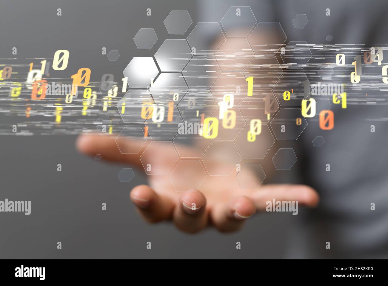 3D rendering hologram of binary codes and network of hexagons between a person's palm Stock ...