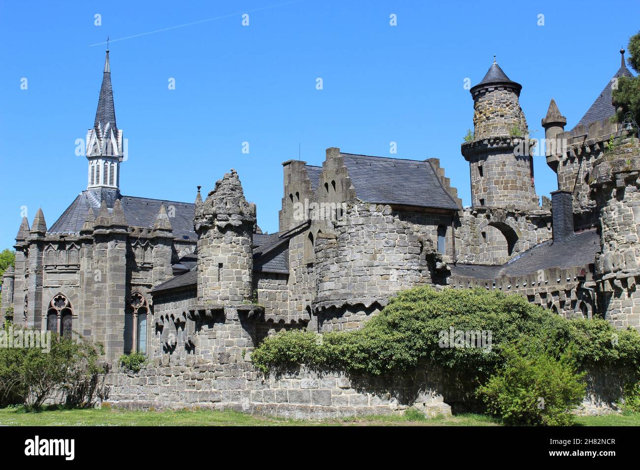 Famous old historic Lowenburg castle against a blue sky on a sunny day ...
