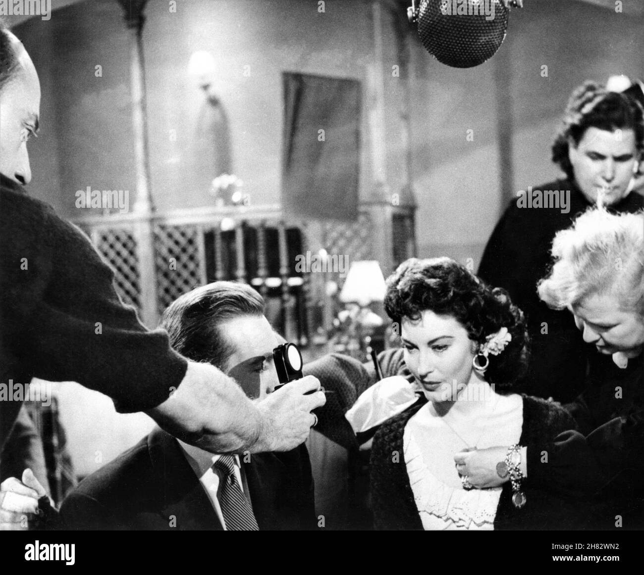 Cinematographer JACK CARDIFF with Light Meter on set candid with WARREN ...