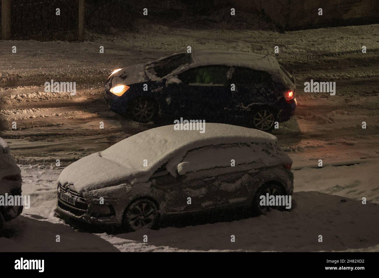 Early morning commuters get stuck in heavy snow as it falls across the ...