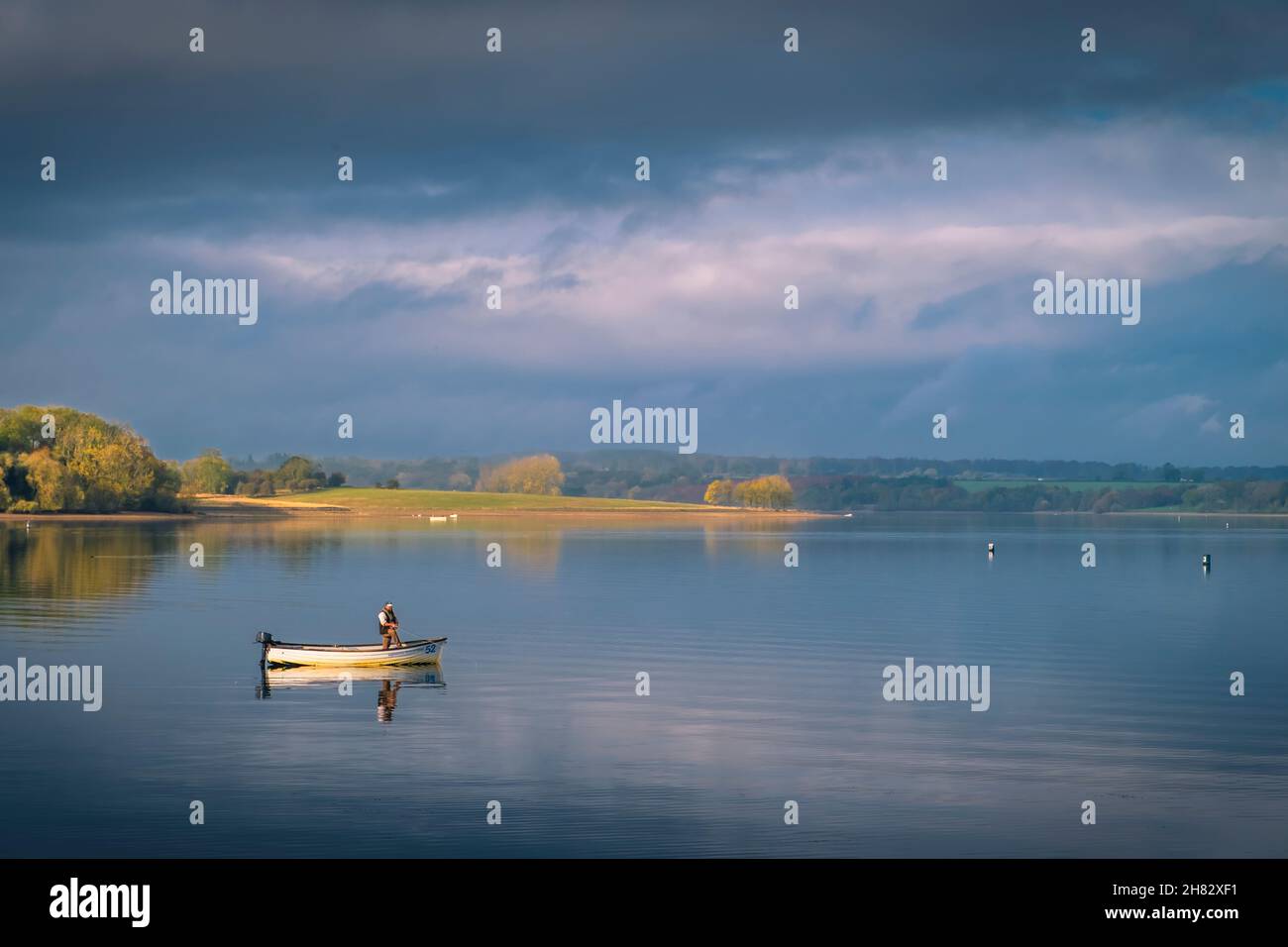 Trout fishing from a boat on a calm day at Rutland Water Stock Photo ...