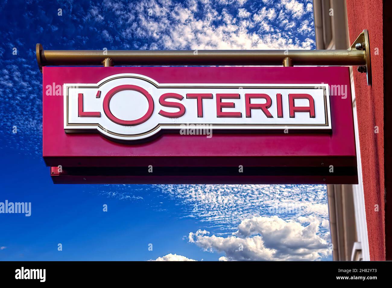 Losteria lettering and logo above the entrance of the pizza and pasta ...