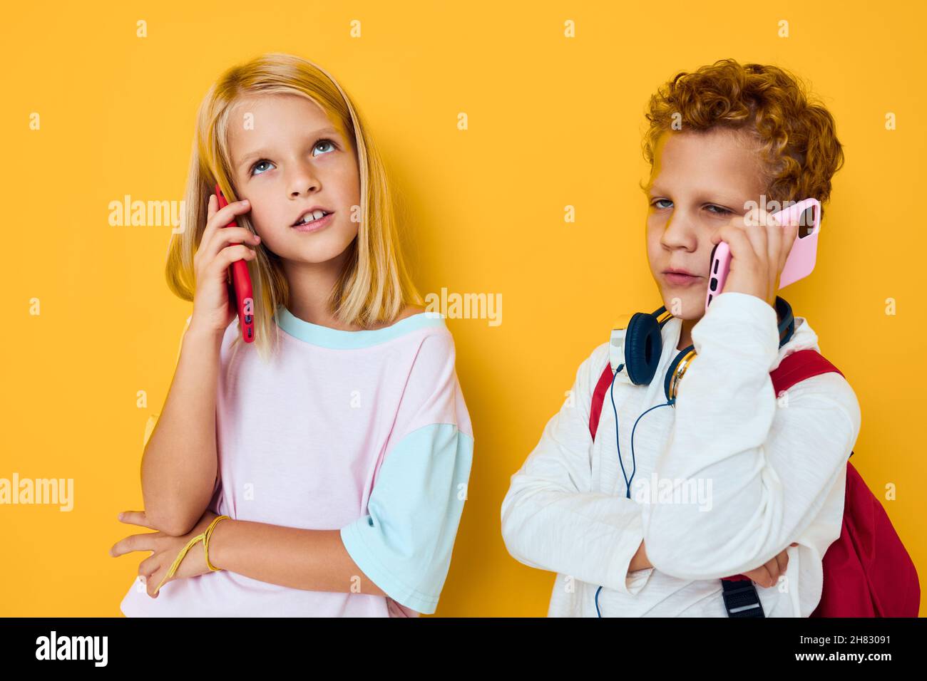 teenage boy and girl use gadgets with headphones Stock Photo - Alamy