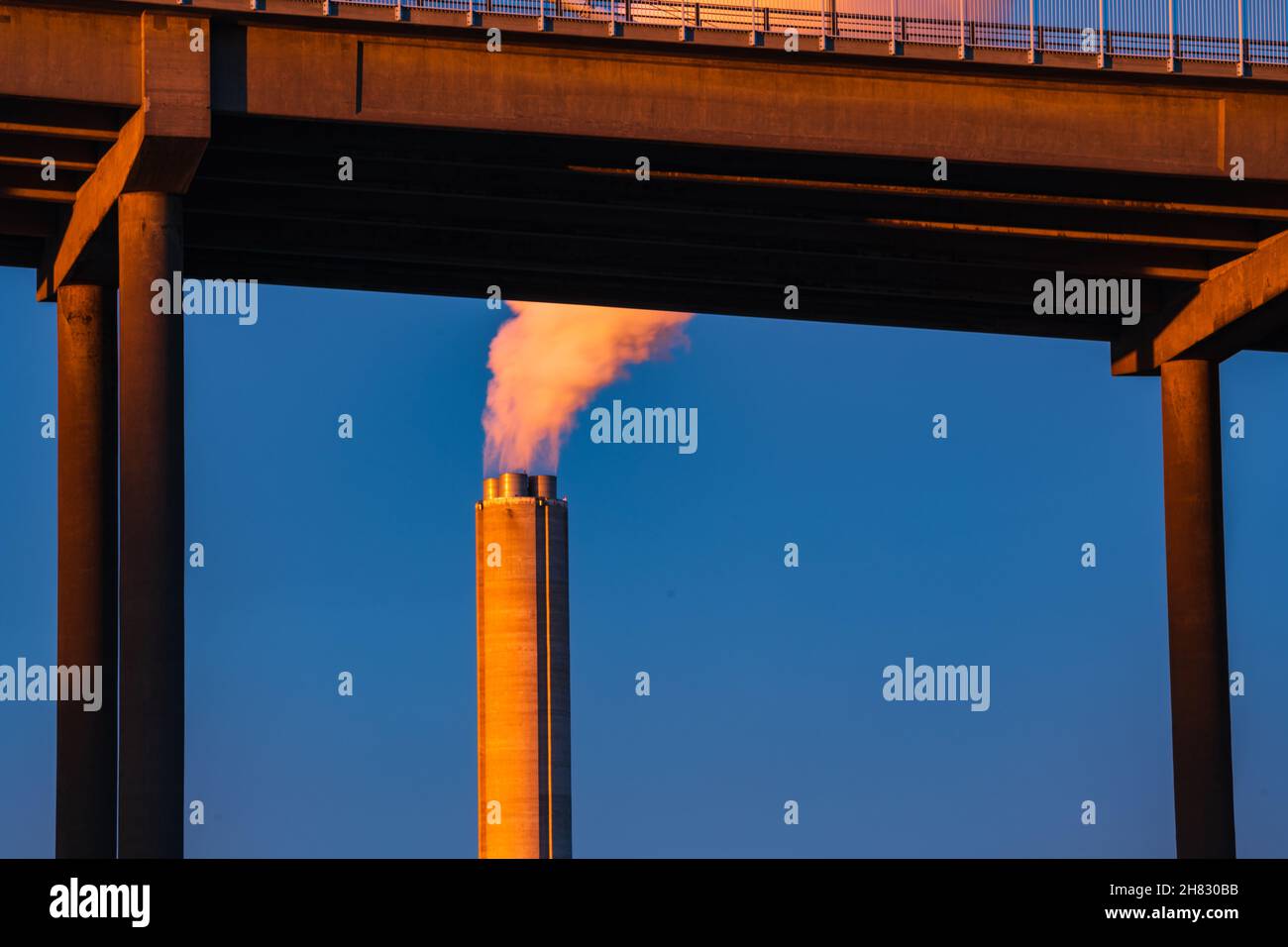 Bridge in front of smoke stack Stock Photo - Alamy